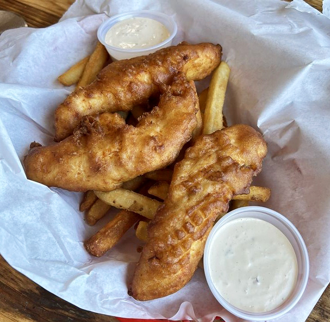 Golden-battered fish that shatters with each bite, paired with fries that could make a Frenchman weep. Simplicity that speaks volumes.
