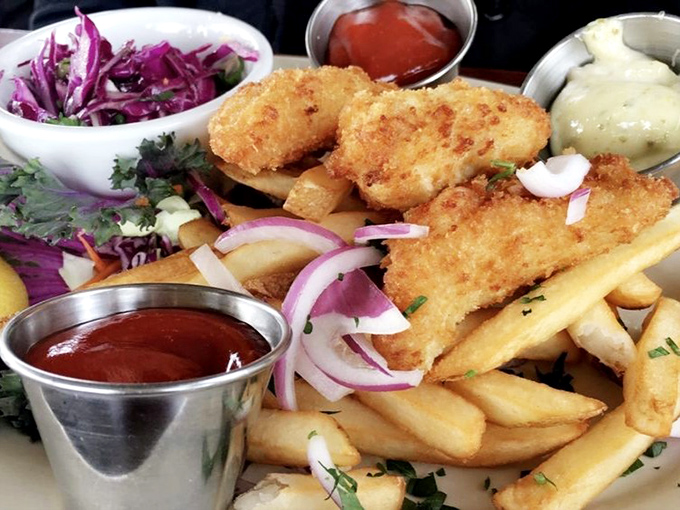 Golden-battered fish that shatters with each bite, paired with fries that could make a Brit homesick. The purple slaw adds both color and conscience.