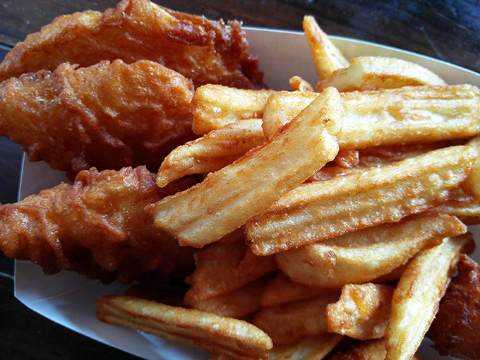 Golden-battered fish nestled against crispy fries&mdash;this isn't just fish and chips, it's edible sunshine that crunches between your teeth.