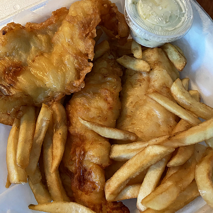 Golden-battered fish that shatters with each bite, paired with fries that achieve the perfect crisp-to-fluffy ratio. Worth every calorie.
