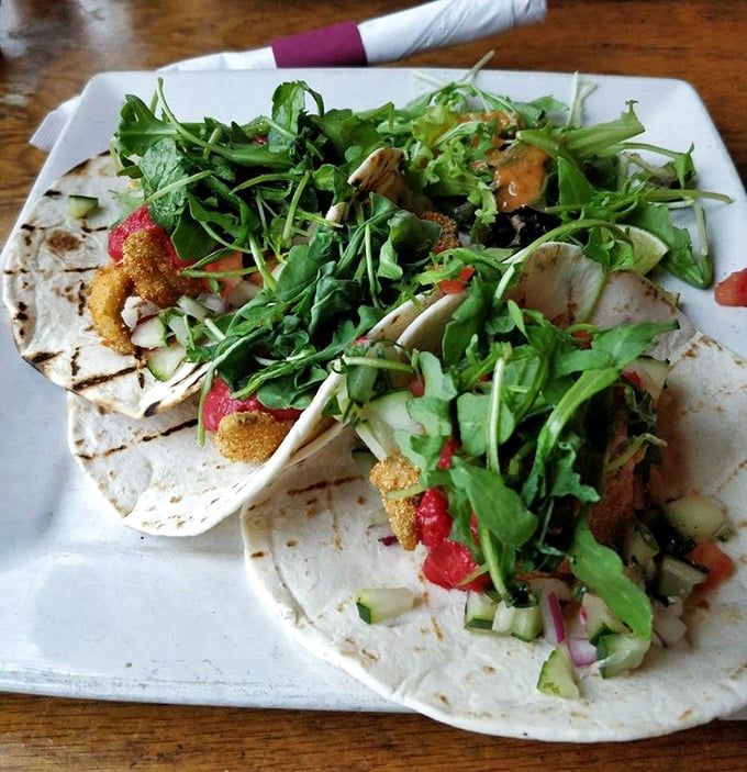 These aren't just fish tacos&mdash;they're edible proof that Wisconsin knows more than cheese. Fresh greens cascade over crispy fish like a delicious waterfall.