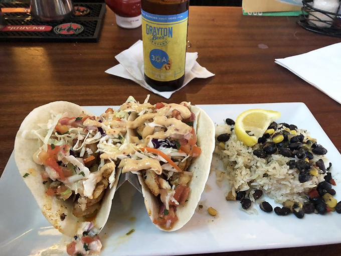 These fish tacos aren't just a meal&mdash;they're a beach vacation wrapped in a tortilla. The black bean and corn rice side dish is no mere afterthought.