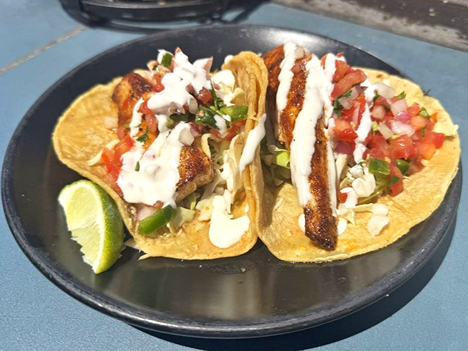 These aren't just fish tacos; they're edible postcards from the Pacific. Grilled perfection, fresh pico, and that white sauce that haunts your dreams.