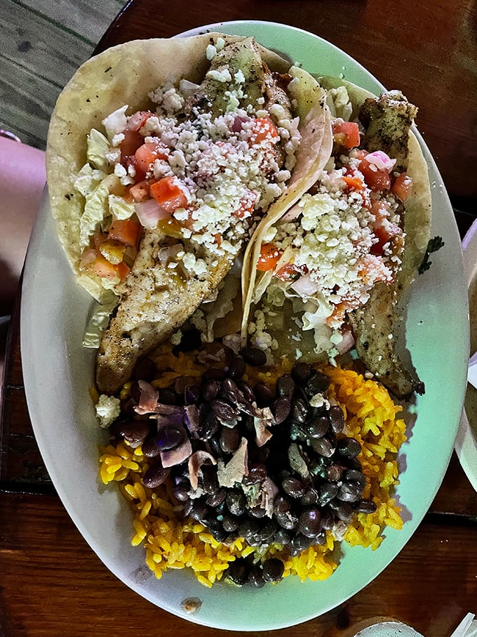 These fish tacos aren't just a meal, they're a vacation on a plate&mdash;seasoned fish, fresh pico, and that perfect rice-and-beans foundation that makes everything better.