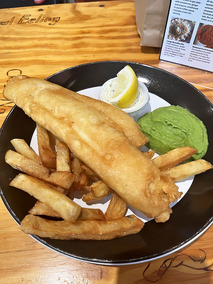 Golden-battered fish that shatters like glass, chips with the perfect crisp-to-fluffy ratio, and that vibrant mushy peas&mdash;Britain's finest export.