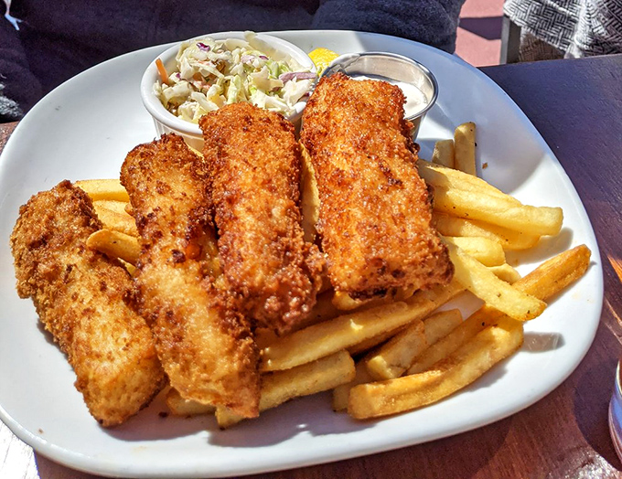 Golden-battered perfection that makes British fish and chips weep with inadequacy. The crunch you hear is the sound of happiness.