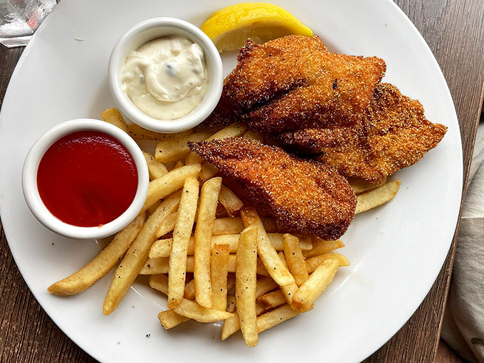 Golden perfection on a plate: crispy battered fish with fries that would make any British pub jealous of California's coastal magic.