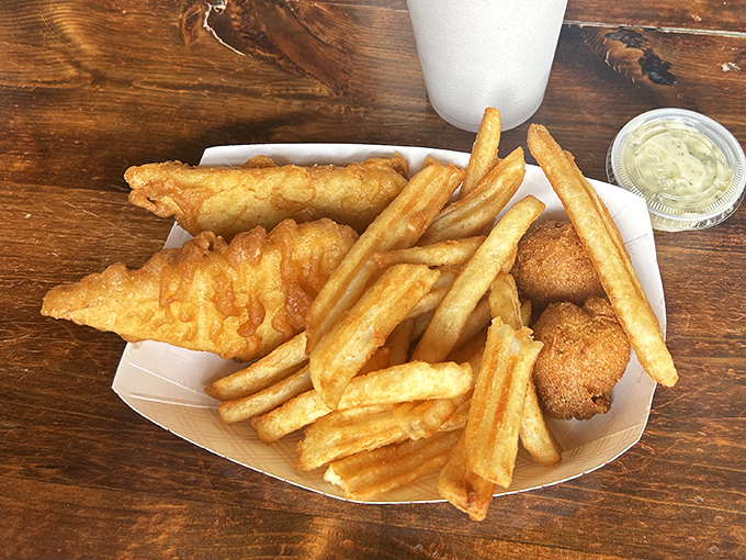 Golden perfection on a plate - fish and chips that would make any seaside town jealous.