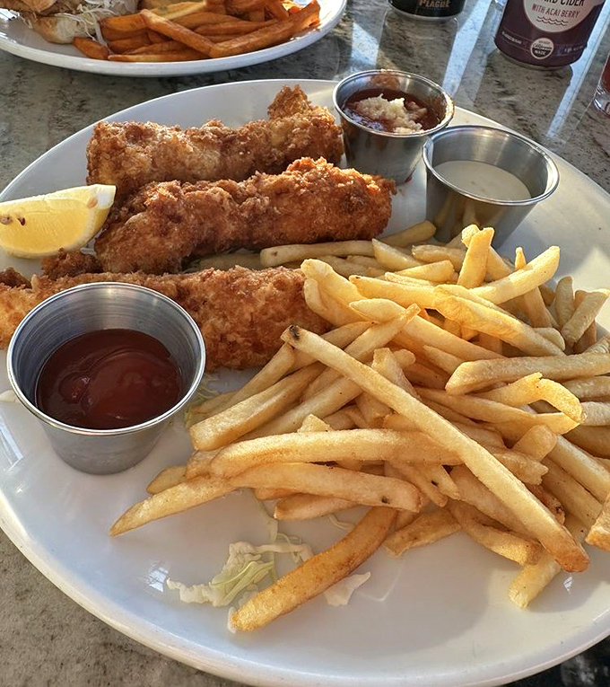 Golden-battered fish fillets and perfectly crisp fries—the kind of fish and chips that makes you wonder why you'd ever order anything else.