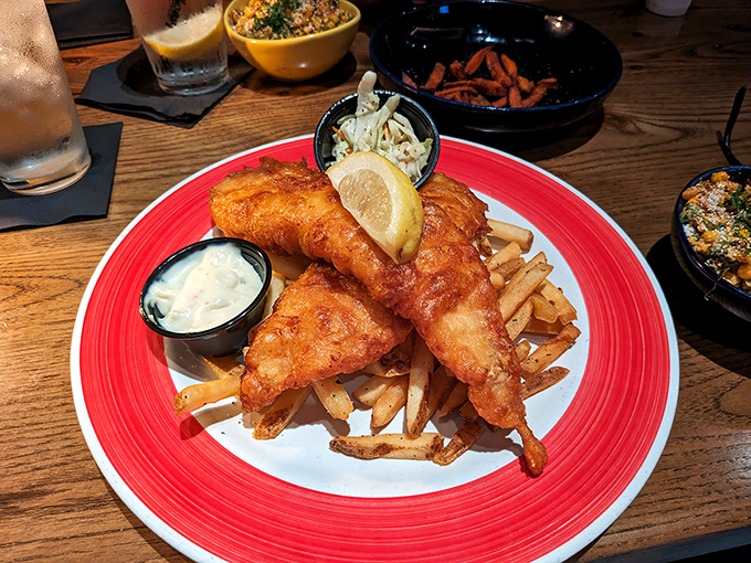 Golden-battered fish resting on a bed of crispy fries&mdash;the kind of plate that makes you forget your diet resolutions instantly.