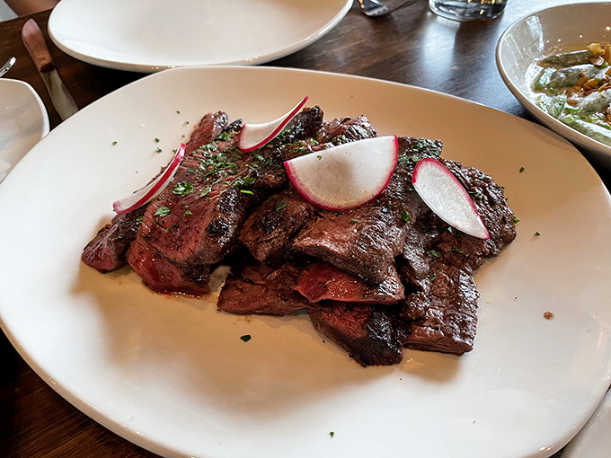 Behold the star of the show: flank steak with a perfect char that would make even vegetarians consider a temporary career change.