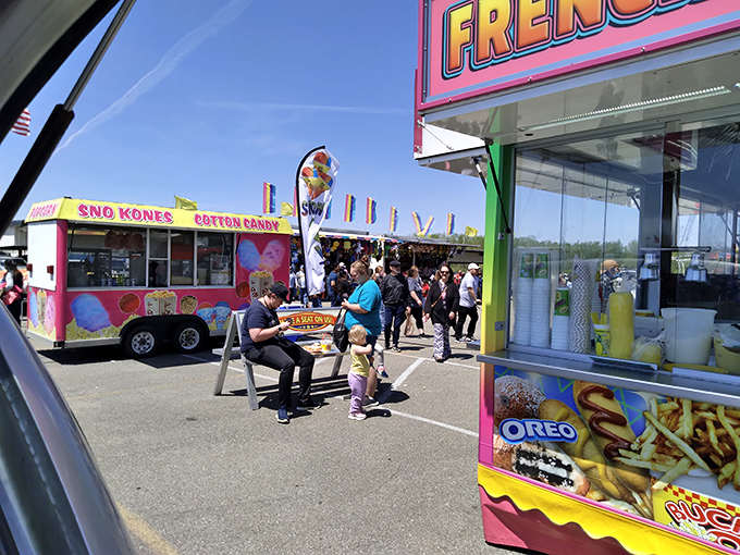 The vibrant food court area offers a carnival-like atmosphere with colorful vendor stalls selling everything from funnel cakes to frozen treats.