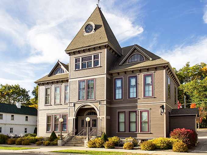 This isn't just a building with a clock tower; it's a time machine disguised as architecture, standing proudly as Harbor Springs' Victorian-era masterpiece.