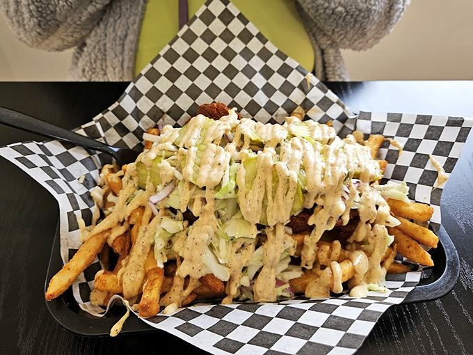 Loaded fries that don't mess around&mdash;crispy potatoes buried under a landslide of sauce and toppings that make sharing both necessary and impossible. 
