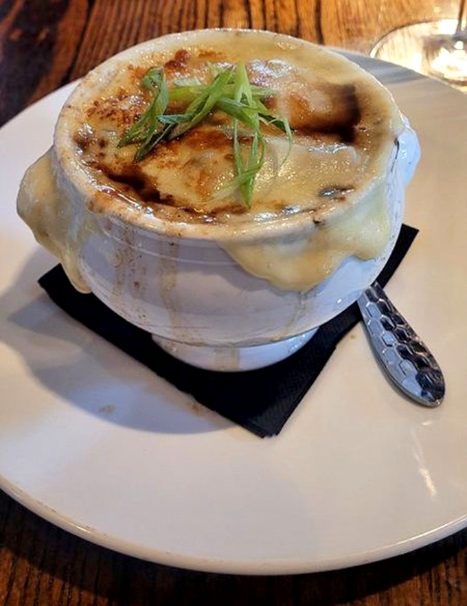 The French onion soup that launched a thousand cravings. That cheese pull should have its own Instagram account, and the broth beneath deserves a standing ovation.
