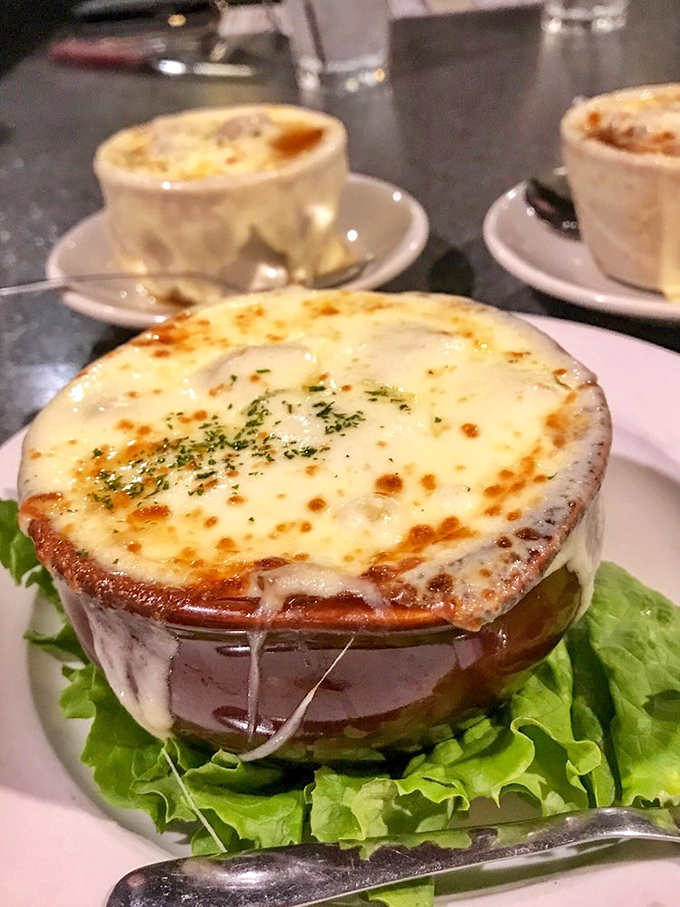 This isn't just French onion soup &ndash; it's a bubbling cauldron of cheese stretching to heaven, with a broth so rich it could buy a small country.