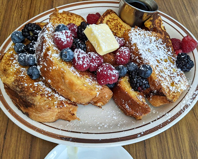 French toast that deserves its own SAG card. Those berries aren't just garnish&mdash;they're supporting actors in a breakfast blockbuster.