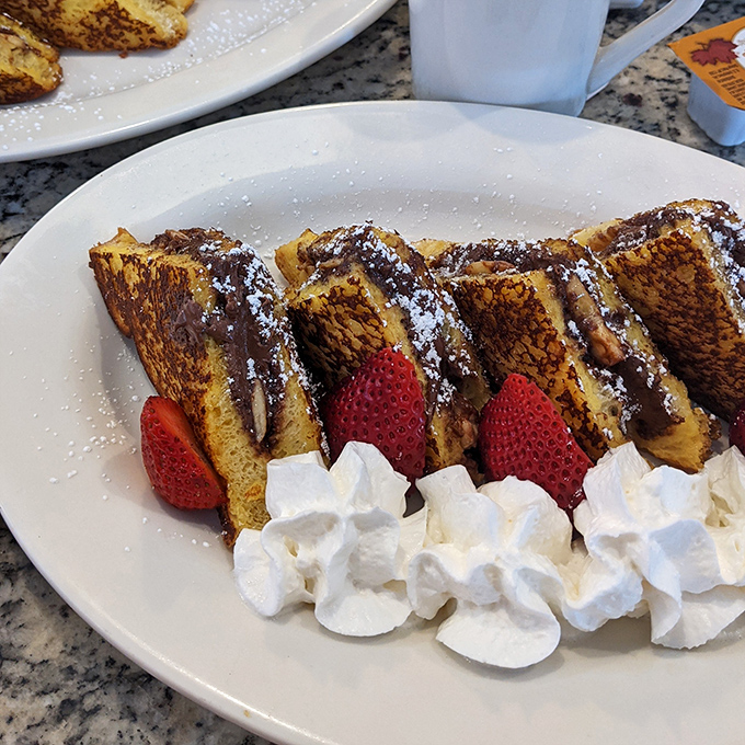 Behold the French toast that launched a thousand morning commutes &ndash; powdered sugar falling like sweet snow.
