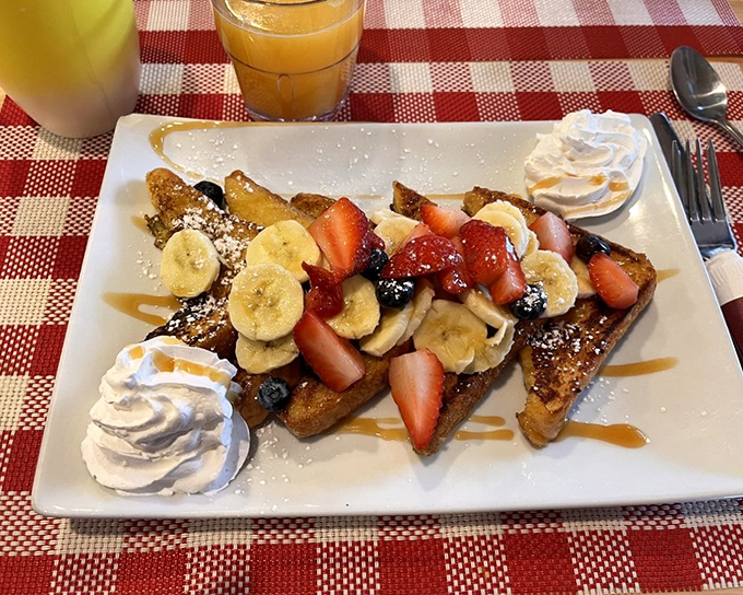 French toast that makes you question every other breakfast you've ever had. Fresh berries, bananas, and whipped cream transform bread into something transcendent.