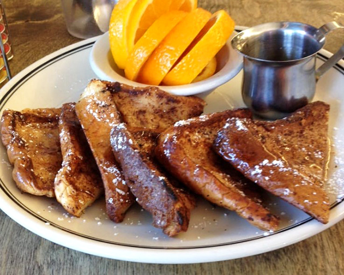Golden slices of French toast that would make Marie Antoinette say, "Forget cake!" Served with fresh orange and that little pitcher of maple-y happiness.