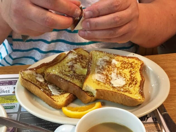 Golden-brown French toast that's achieved that perfect balance &ndash; crispy edges, custardy center, and just waiting for that maple syrup waterfall.