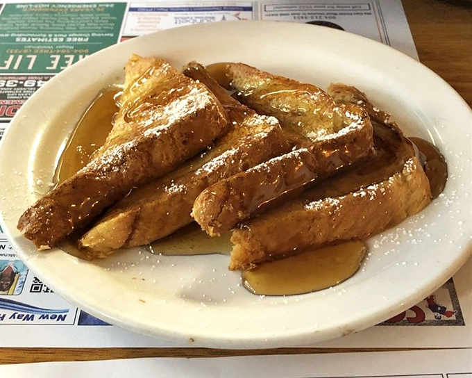 French toast that's achieved celebrity status in its own right&mdash;golden, crispy edges giving way to a custardy center that's worth setting the alarm for.