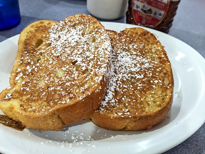 Golden perfection dusted with powdered sugar - French toast that makes mornings worth celebrating again.