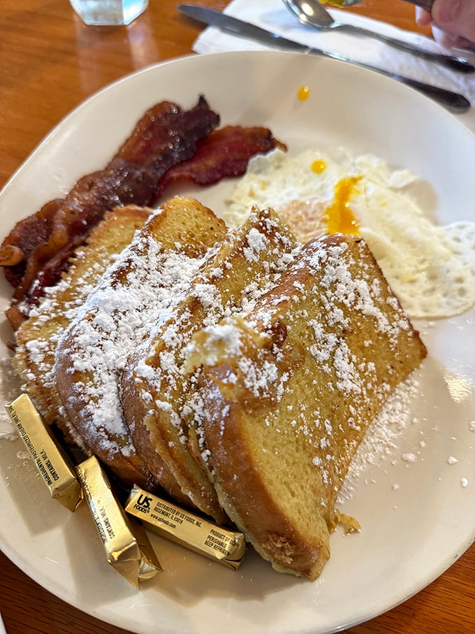 The French toast that launched a thousand road trips. Dusted with powdered sugar and served with real butter, it's the breakfast equivalent of a standing ovation.