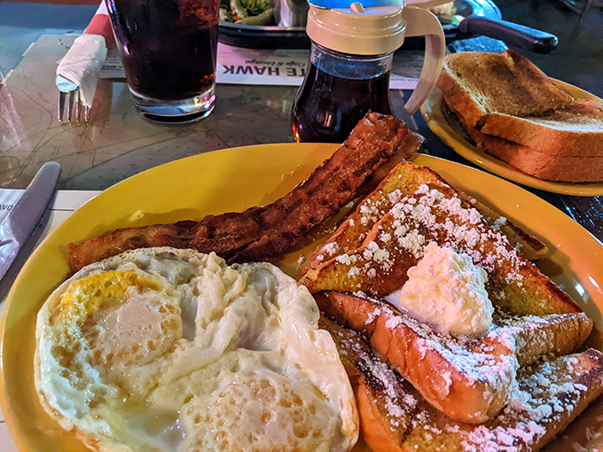The French toast combo that launched a thousand food dreams&mdash;golden, powdery perfection flanked by eggs and bacon like loyal courtiers.