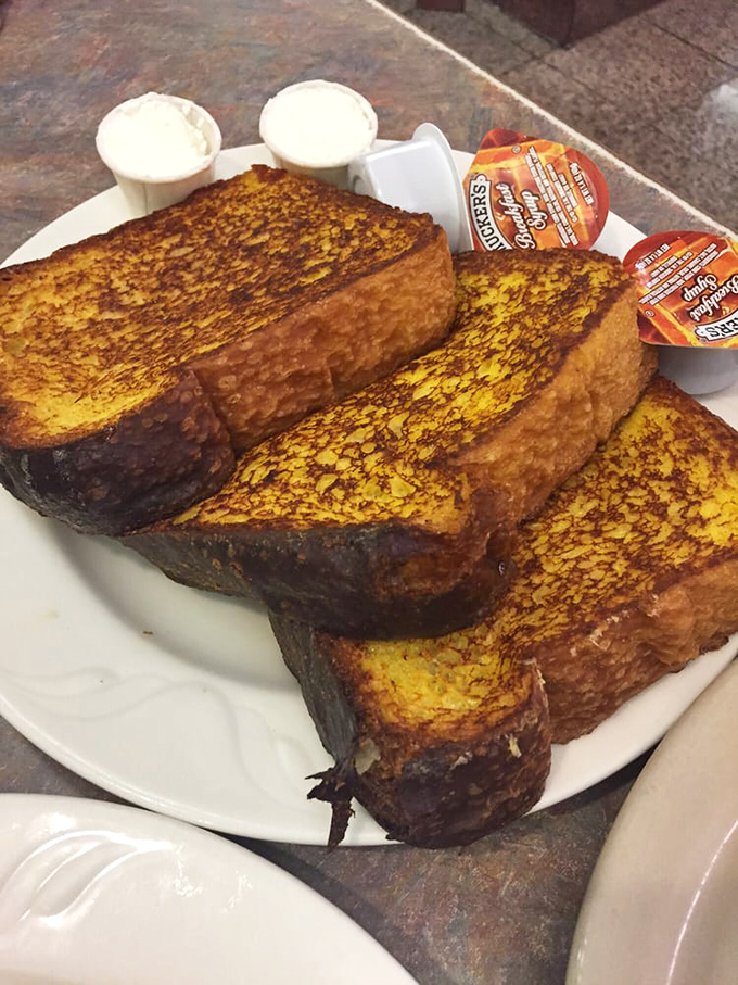 French toast that's achieved golden-brown perfection. This isn't breakfast&mdash;it's a buttery canvas waiting for that maple syrup waterfall.