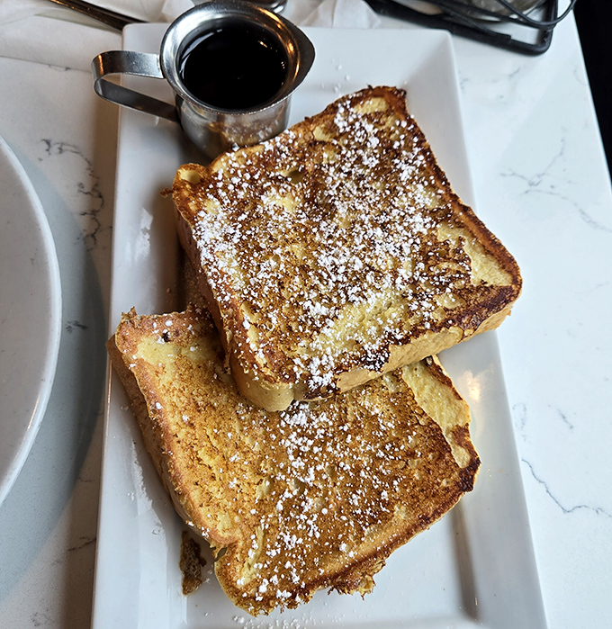 Golden-brown French toast dusted with powdered sugar&mdash;proof that the simplest pleasures are often the most satisfying.