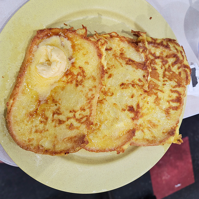 Golden perfection on a plate - this French toast could make a grown person weep tears of joy.