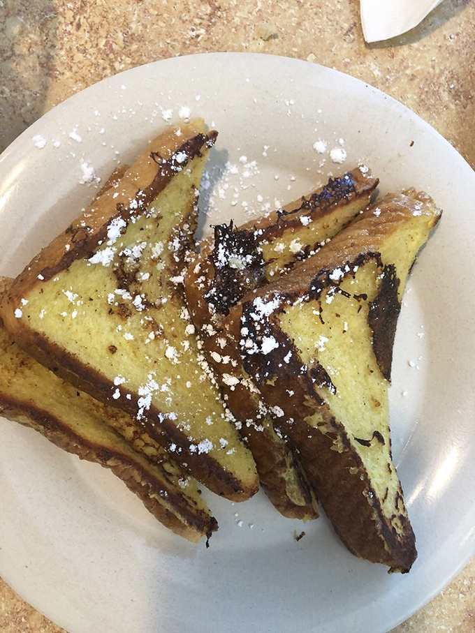 This French toast doesn't just steal the show&mdash;it runs away with the entire theater. Golden, custardy perfection dusted with powdered sugar.
