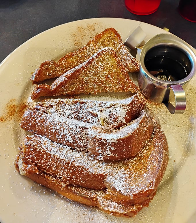 Golden challah French toast that makes people drive across state lines for weekend breakfast pilgrimages.