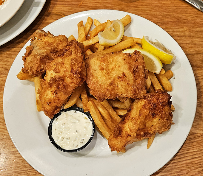 Golden-brown fried chicken that could make Colonel Sanders weep with jealousy, served with crispy fries and house-made tartar sauce.