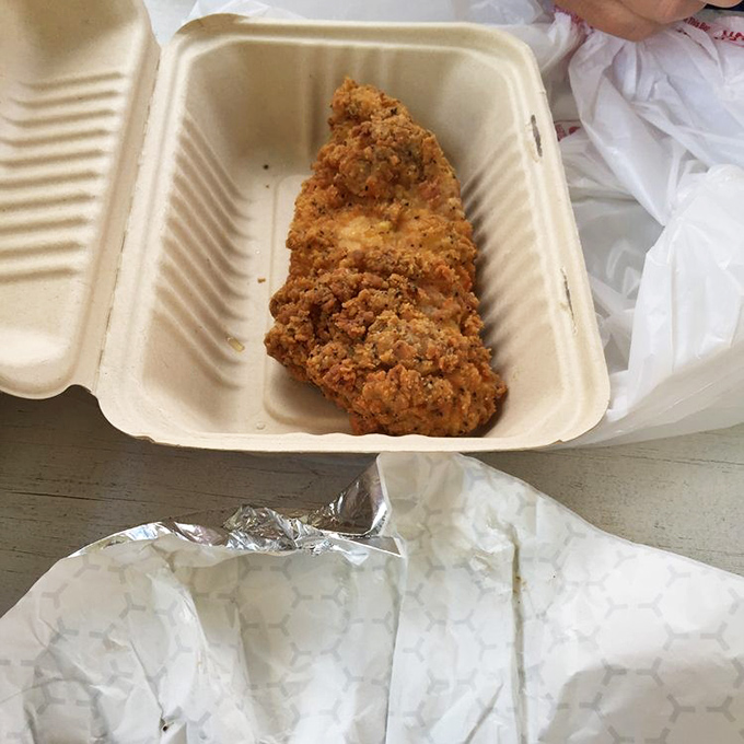 Golden-brown perfection in a takeout container. This fried chicken doesn't need fancy plating &ndash; its crackling crust speaks volumes about what awaits inside.