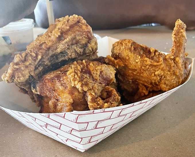Golden-brown perfection that makes Colonel Sanders look like he's still in basic training. This chicken doesn't just cross roads—it creates pilgrimages.