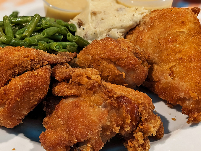 Golden-brown perfection that makes you question every other fried chicken you've ever eaten. The crunch is practically audible through the photo.
