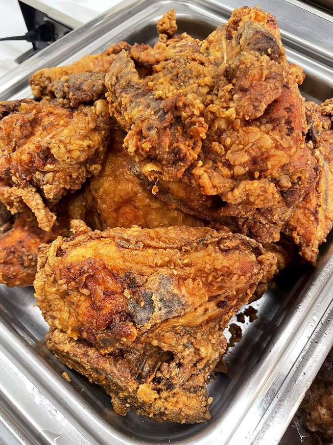 Fried chicken so perfectly golden and crispy, it makes Colonel Sanders look like he's still in basic training.