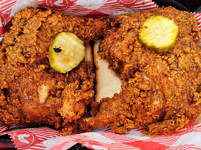 Glistening with spiced oil and topped with cooling pickle chips, this chicken isn't just fried&mdash;it's been elevated to an art form.