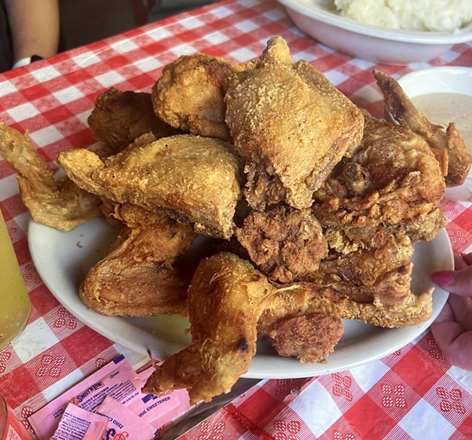 Golden-brown perfection that makes you want to slap the table. This isn't just fried chicken&mdash;it's edible history with a side of culinary reverence.