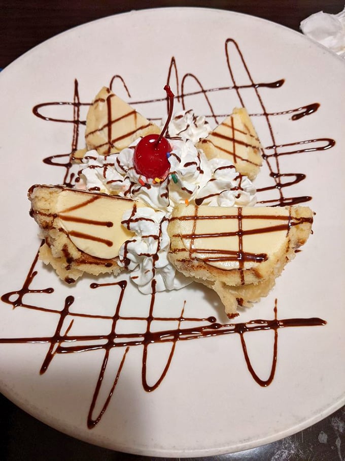 Behold the star attraction! Yukon's fried ice cream arrives like edible architecture &ndash; crispy exterior, cold creamy center, and artistic chocolate drizzles worthy of a gallery opening.