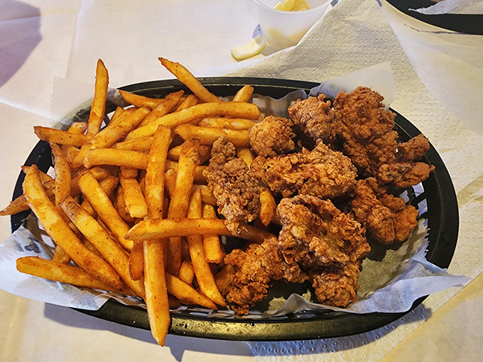Golden-brown nuggets of happiness paired with crispy fries. These aren't just fried oysters&mdash;they're edible proof that perfection exists in this world.