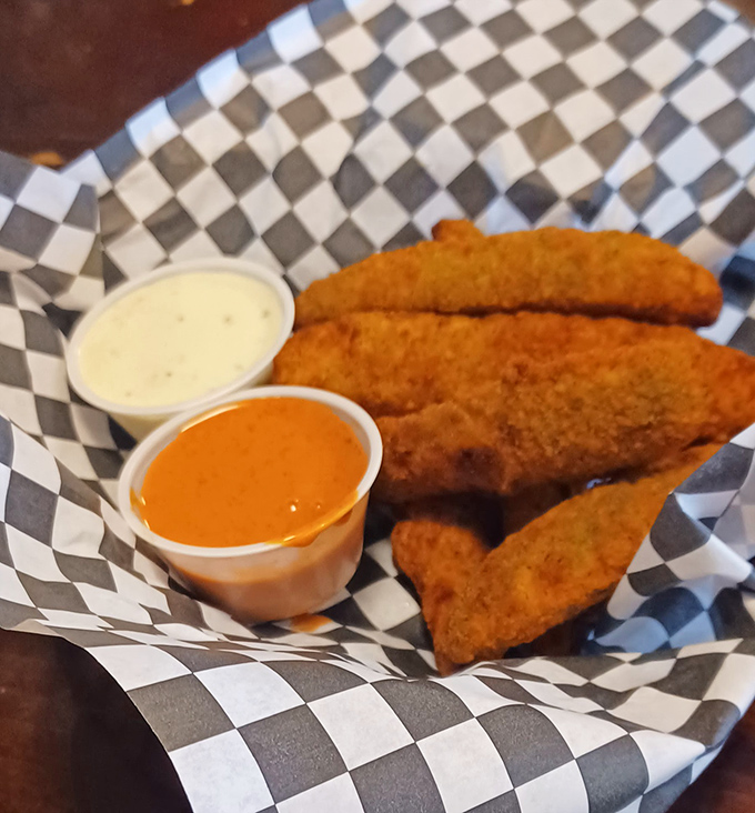 Golden-brown fried pickle spears that shatter with each bite, served with dipping sauces that make you question why you've wasted time on lesser appetizers.