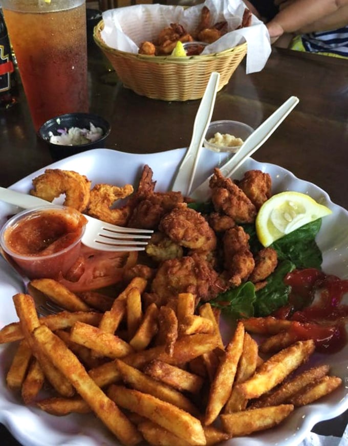 Golden-fried shrimp that crunch like autumn leaves, paired with fries that could make a potato proud.