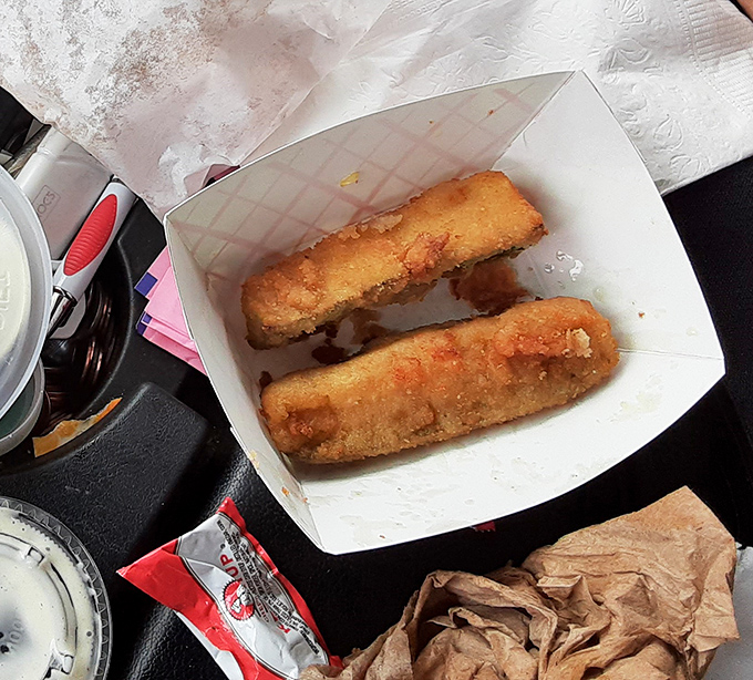 Golden treasures that make vegetables worth celebrating. These fried zucchini sticks aren't just side dishes—they're the main event that'll have you plotting your return journey.