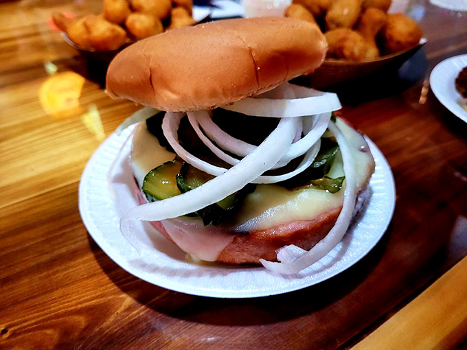 The star of the show: an inch-thick slab of grilled bologna, melted cheese, pickles, and onions on a soft bun. Childhood lunch, all grown up and magnificent.