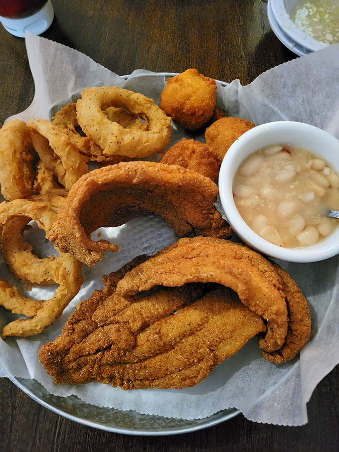 Golden-fried catfish that shatters with each bite, paired with those legendary white beans. This is Tennessee comfort in its purest form.