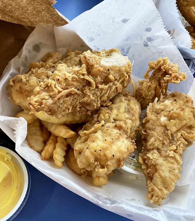 Golden-brown perfection that makes you want to high-five strangers. This fried chicken achieves that mythical balance of crackling crust and juicy interior that haunts your dreams.