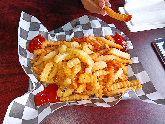 These aren't just fries&mdash;they're crinkle-cut works of art that somehow maintain their structural integrity from first dip to last bite.